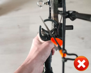 How to nock an arrow - follow these 5 steps - ImproveYourArchery.com